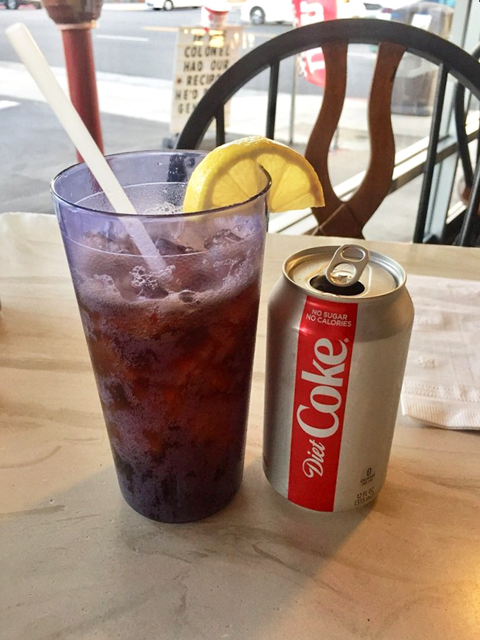 Even the beverages understand their supporting role in this chicken drama. That lemon wedge adds a touch of class to your Diet Coke.