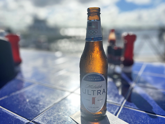 A cold beer with water views &ndash; nature's perfect pairing and proof that sometimes the simplest pleasures are the most profound.