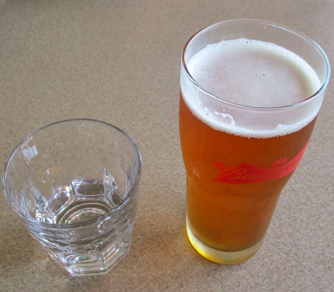 A cold beer alongside a water chaser&mdash;the perfect companion to cut through the richness of seafood and prepare you for the next delicious bite.