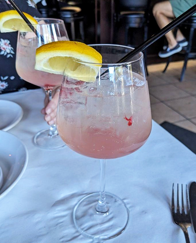 These blush-colored cocktails garnished with lemon slices aren't just drinks; they're liquid vacation moments waiting to transport you to a Mediterranean coastline. 