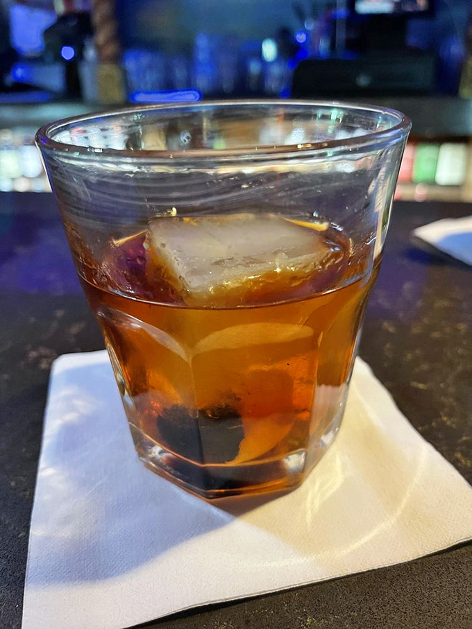 An old fashioned that actually tastes like one &ndash; amber liquid over a proper ice cube, no smoke show or fancy garnish required.