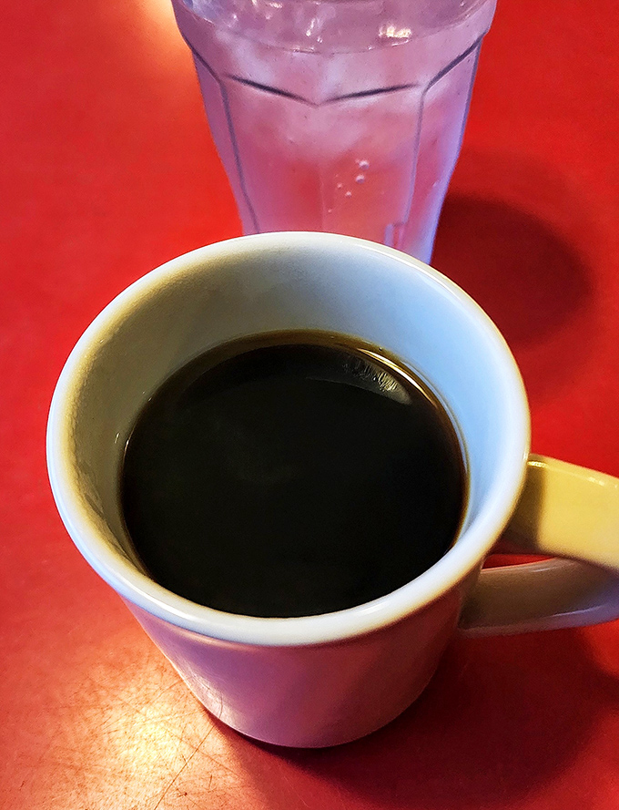The diner coffee ritual &ndash; strong, honest brew in a sturdy mug with ice water on standby. No foam art needed when the coffee's this good.