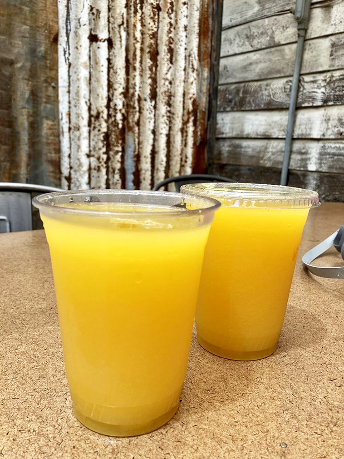Fresh-squeezed sunshine in a cup. These vibrant orange juices against the weathered wood backdrop perfectly capture The Old Place philosophy: simple pleasures done extraordinarily well.
