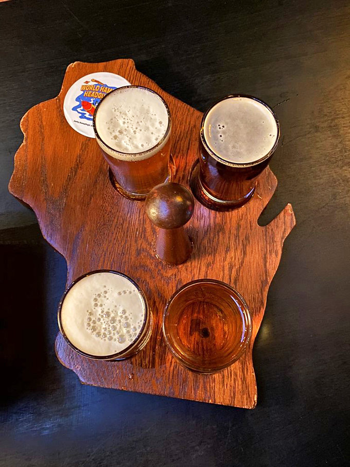 Beer served on a Wisconsin-shaped board&mdash;because when in the Badger State, even your drink tray celebrates local pride.
