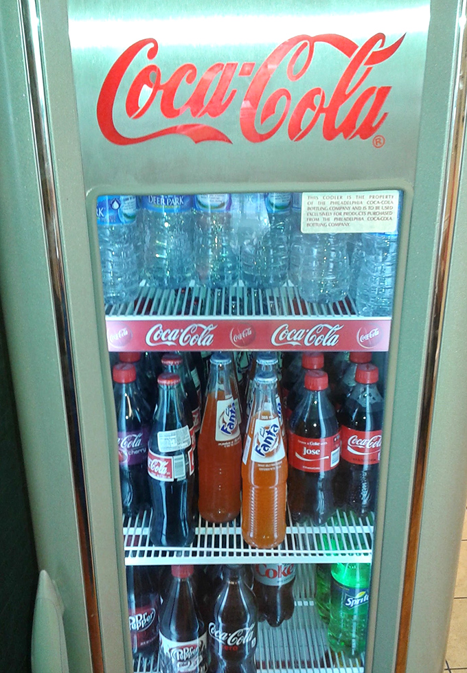 The vintage Coca-Cola cooler isn't just storing drinks&mdash;it's preserving a slice of Americana. Cold soda and fried chicken: a pairing as timeless as Bogart and Bacall.