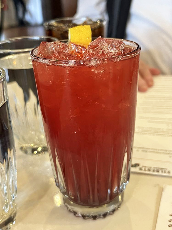 This ruby-red cocktail isn't just a drink, it's a sunset in a glass. The perfect companion for stories that get better with each sip.