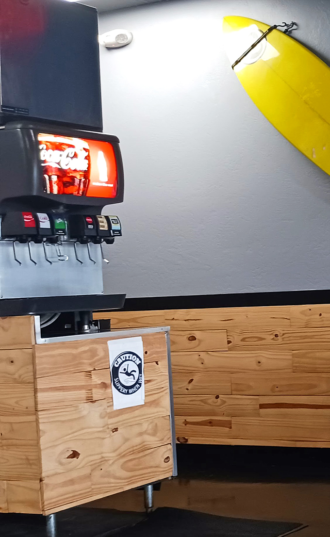 Even the drink station has coastal charm &ndash; that yellow surfboard isn't just decoration, it's foreshadowing the wave of flavor about to crash onto your taste buds.