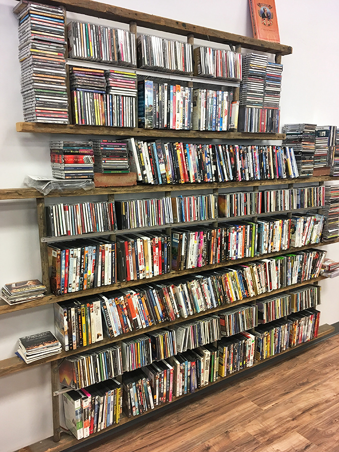 Media nirvana for film buffs! These wooden shelves hold forgotten classics and guilty pleasures alike. Netflix can't compete with this tangible library.