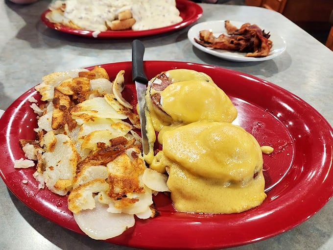 Eggs Benedict: where hollandaise sauce dreams come true. Those home fries look like they've achieved the perfect crisp-to-tender ratio.