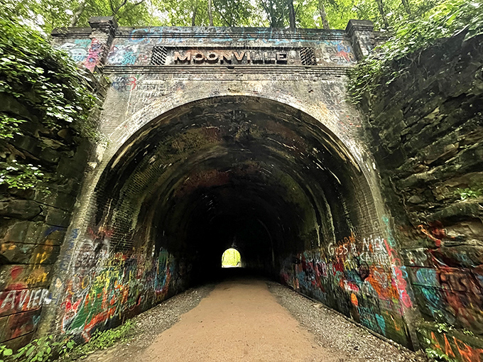 The name "Moonville" carved above the entrance serves as both welcome sign and warning to those who dare enter.