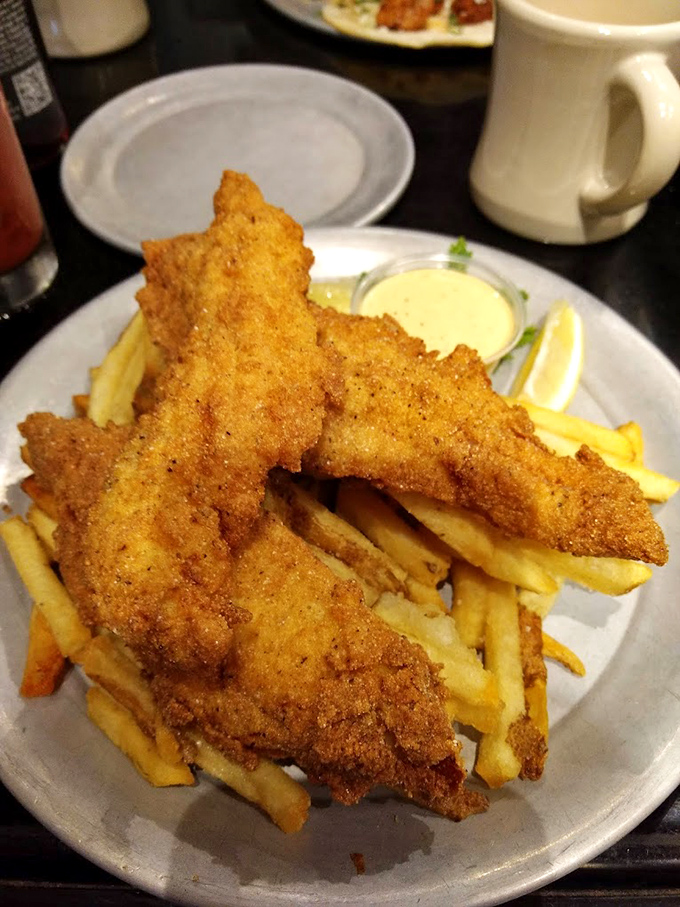 Fish and chips so golden and crispy they deserve their own trophy &ndash; the kind of comfort food that makes you want to hug the chef.