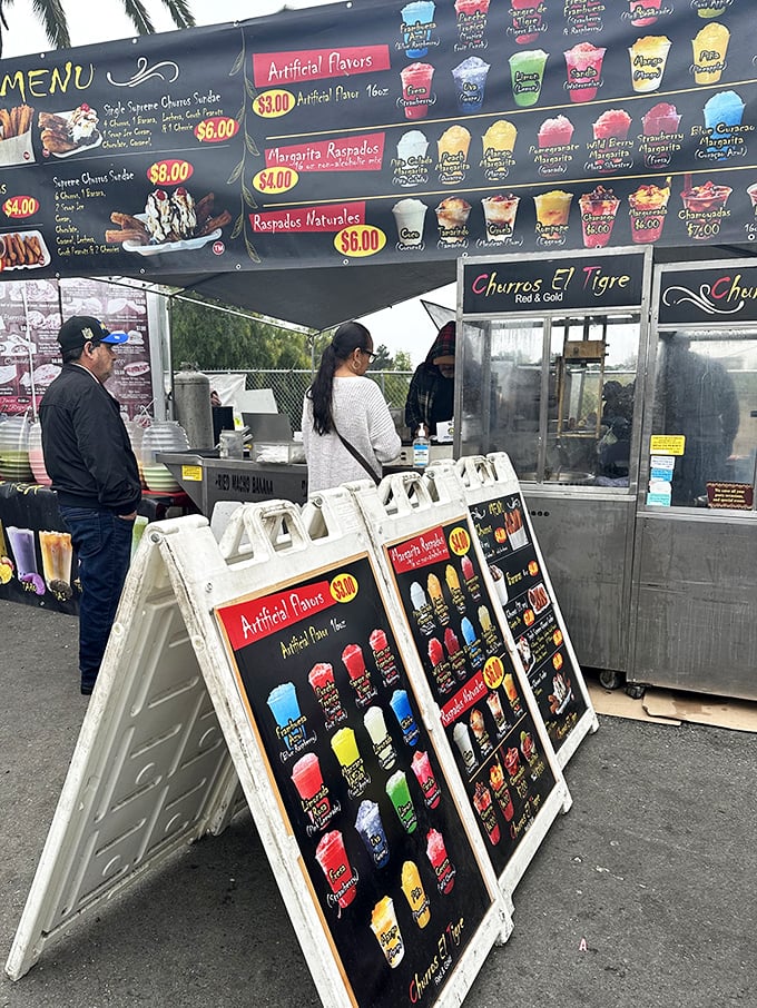 Churros El Tigre's menu board promises frozen delights and fried dough perfection. The hardest decision you'll make today is which flavor to choose.