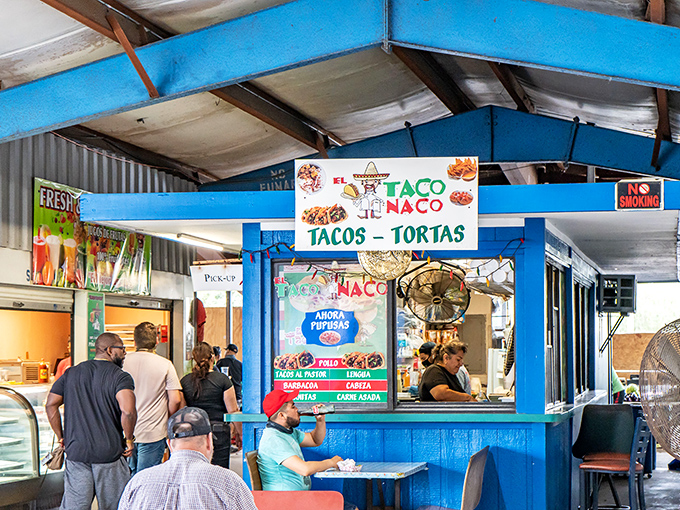 El Taco Naco's vibrant blue stand isn't just a food stall&mdash;it's a cultural embassy where tortillas serve as delicious diplomatic papers between countries.