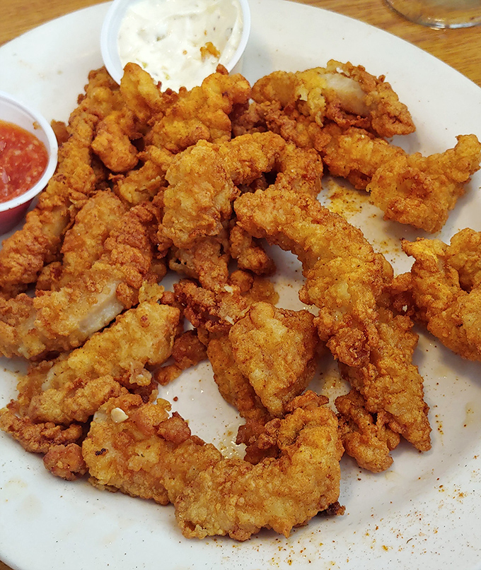 Fried clams arranged like a delicious jigsaw puzzle of crispy goodness. The seafood equivalent of potato chips&mdash;bet you can't eat just one.