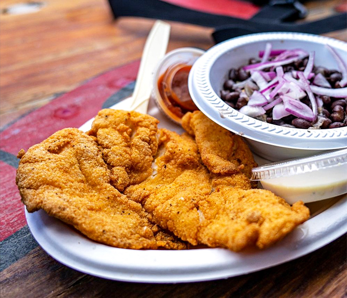 Cornmeal-crusted fish with black beans and onions &ndash; a plate that would make your cardiologist wince and your taste buds send thank-you notes.