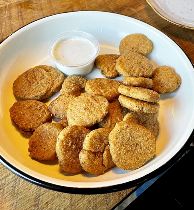 Fried pickles: proof that anything becomes magical when breaded and fried. These golden discs are the potato chip's sophisticated cousin.