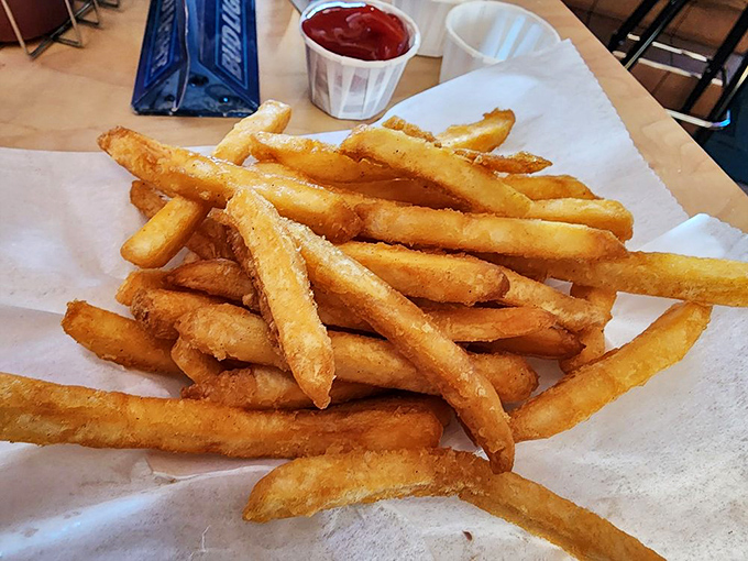 Golden fries that achieve that perfect balance &ndash; crispy exterior, fluffy interior, and just enough salt to make you reach for another and another.