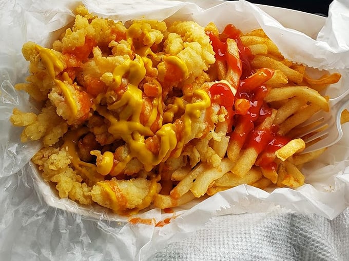 Simple pleasures done right: golden fries with classic condiments, no fancy aioli required or desired.