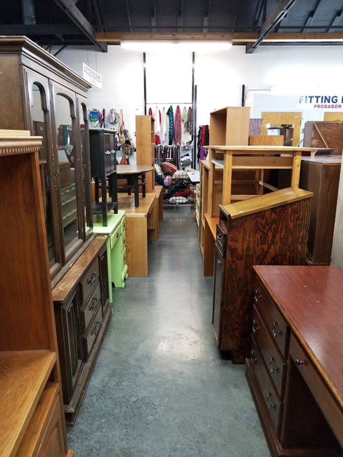 Wooden furniture creates a maze of potential dining rooms and bedrooms. That hutch has definitely seen some Thanksgiving dinners in its day.