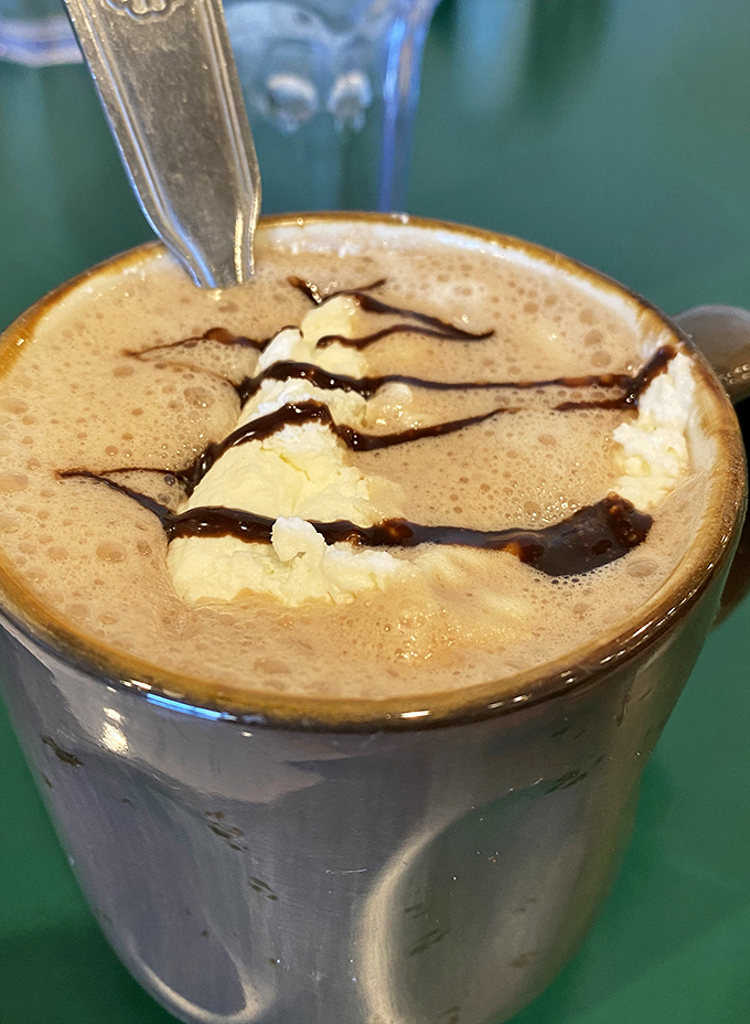 Hot chocolate that makes Swiss miss the point. That mountain of whipped cream with chocolate drizzle turns morning into a celebration.