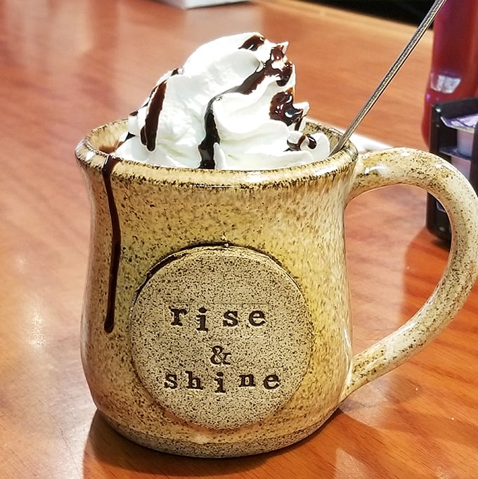 Their hot chocolate arrives in a mug that tells you to "rise & shine" &ndash; though after this whipped cream mountain, a nap might be more appropriate. 