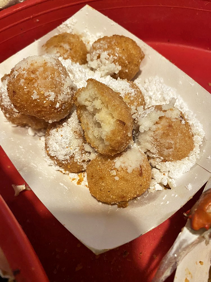 Hush puppies dusted with powdered sugar&mdash;Southern comfort in bite-sized form. Like donut holes that went to seafood finishing school.