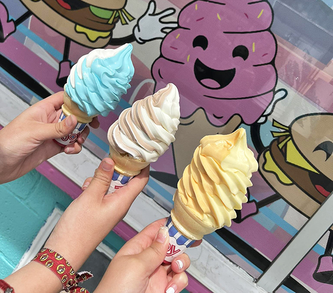 Three perfect swirls of soft-serve standing at attention – blue, white, and yellow – like the ice cream equivalent of a summer sunset.