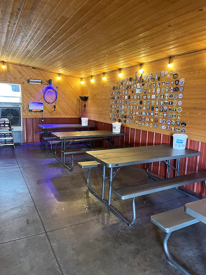 The wall of police patches tells stories of hungry officers who've made the pilgrimage. Even law enforcement can't resist the long arm of good barbecue.