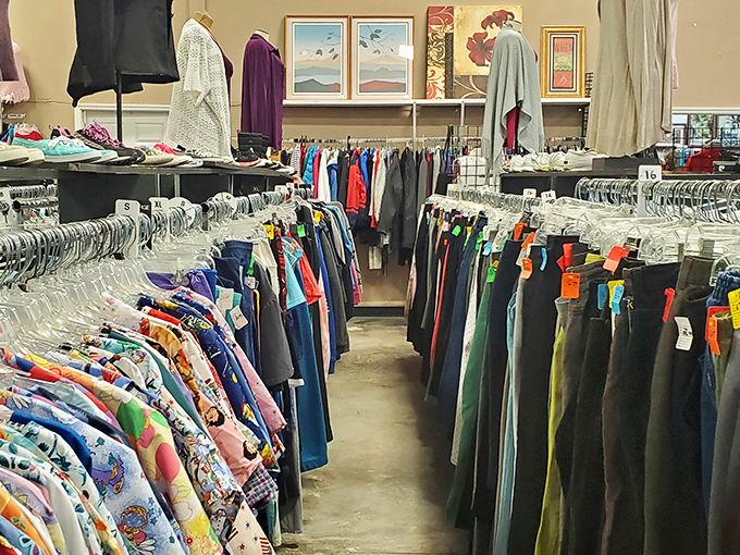 Fashion history hangs in neat rows, where vintage Hawaiian shirts neighbor practical denim in a textile timeline spanning decades of style evolution.