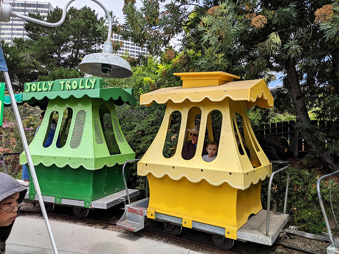 The Jolly Trolly, where "high-speed transportation" means moving just fast enough to feel the breeze but slow enough to wave at everyone.