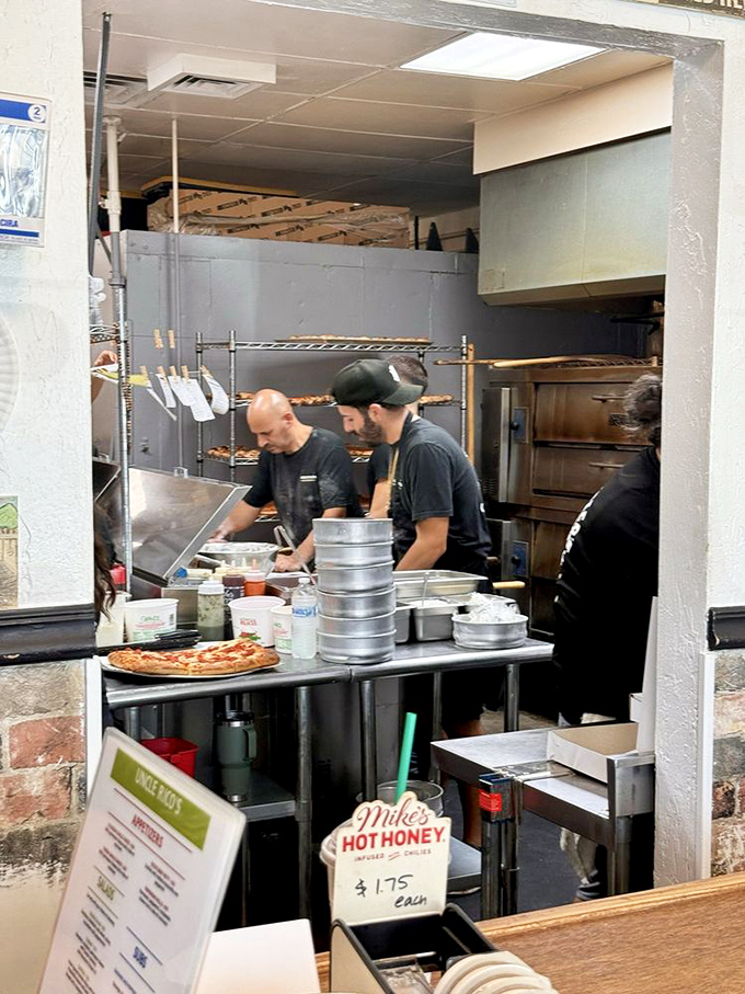 The kitchen reveals the beautiful choreography behind great pizza &ndash; where dough-tossing and topping-arranging become an art form right before your eyes. 