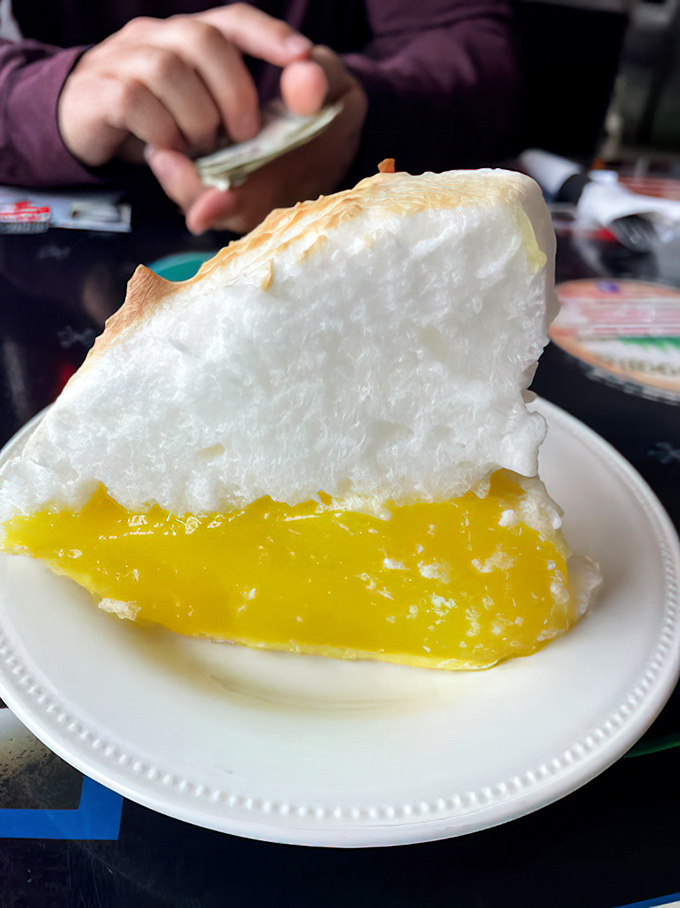 Lemon meringue pie towering with clouds of sweetness &ndash; the kind of dessert that makes grown adults giggle with delight.