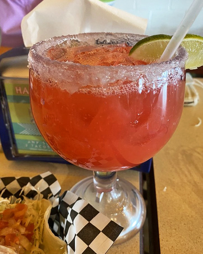 A proper margarita should wear its salt rim like a crown. This ruby-red beauty is vacation in a glass, no matter what day of the week.