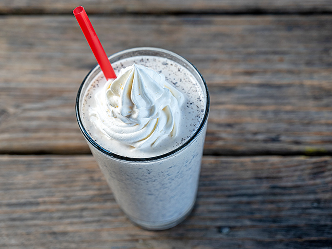 Cloud-like whipped cream atop what must be a milkshake so thick it fights the straw&mdash;dessert and beverage having a beautiful identity crisis.