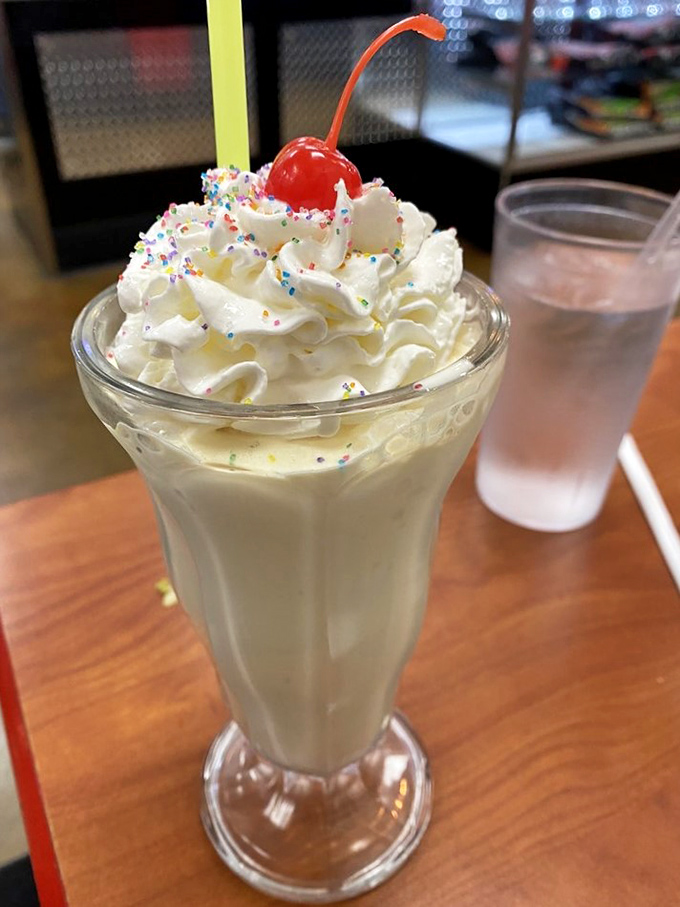 This isn't just a milkshake&mdash;it's a dessert skyscraper topped with whipped cream, sprinkles, and childhood memories. Resistance is futile, just grab a spoon.