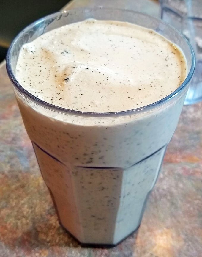 This isn't just a milkshake&mdash;it's a commitment, thick enough to require both a straw and spoon in a glass that's seen decades of dessert dreams.