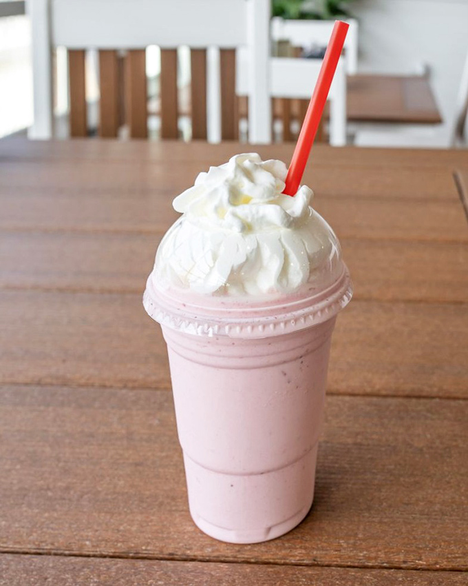 This strawberry milkshake isn't just a drink—it's summer in a cup, topped with enough whipped cream to make your diet plan file for divorce.