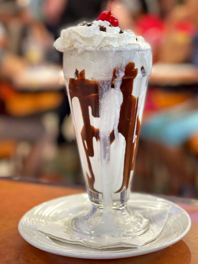This isn't just a milkshake—it's a drinkable masterpiece. The chocolate drizzle creates edible art, while the whipped cream crown demands respect.
