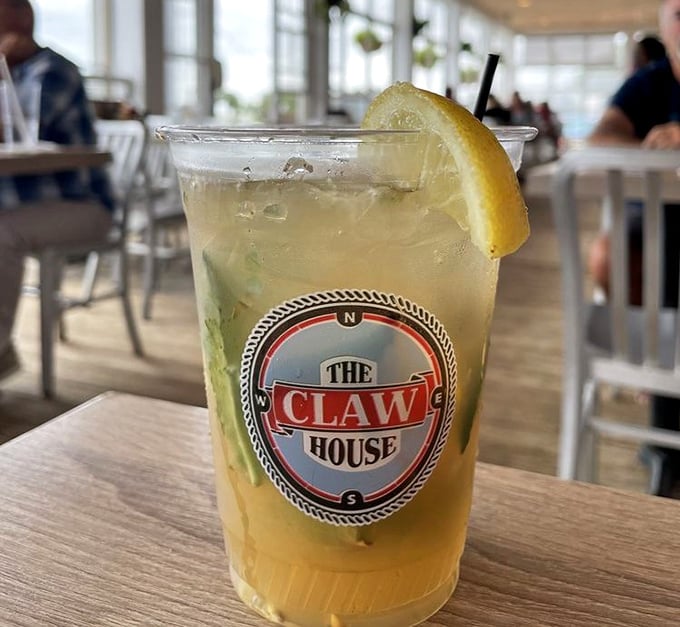 A refreshing cocktail sporting The Claw House logo&mdash;like summer in a cup. The perfect companion while watching boats drift by on the inlet.