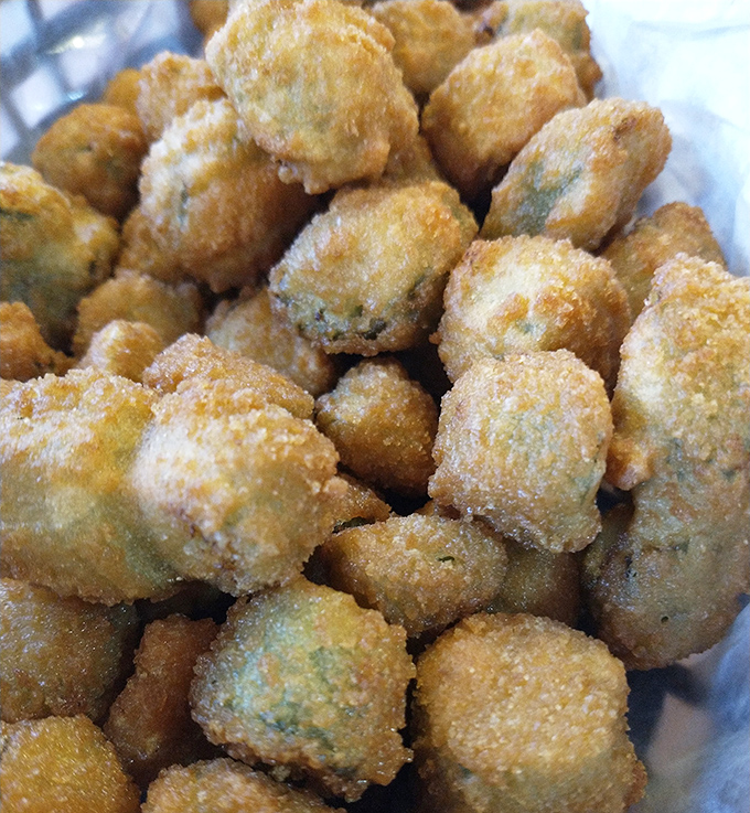 Fried okra nuggets that crunch like nature's popcorn. These golden-brown beauties make even okra skeptics reconsider their life choices.