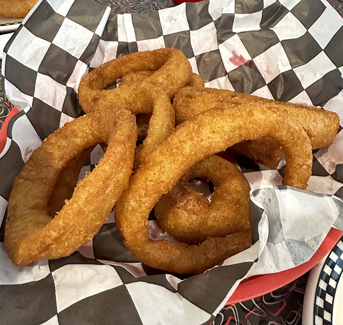 Onion rings with the perfect crunch-to-give ratio. That golden batter shatters just right, like breaking into a cr&egrave;me br&ucirc;l&eacute;e.