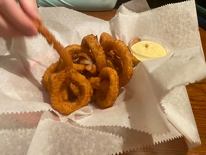 These aren't just onion rings&mdash;they're golden halos of happiness with a dipping sauce that should be sold by the bottle for emergency flavor situations.