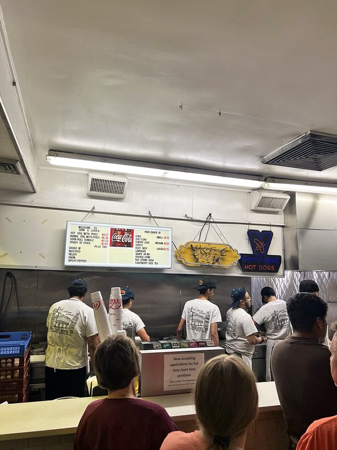 The assembly line of efficiency. Where hot dog dreams are constructed with the precision of a Swiss watch factory.