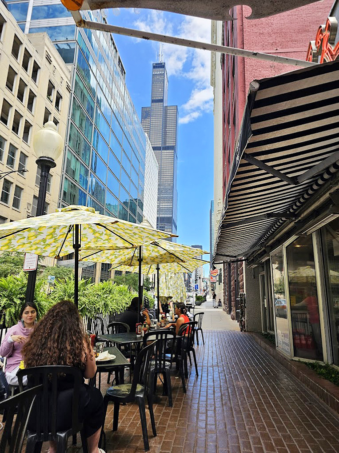 From Lou Mitchell's outdoor seating, you can spot the Willis Tower standing tall &ndash; a reminder that you're dining at the gateway to Chicago's architectural wonders.