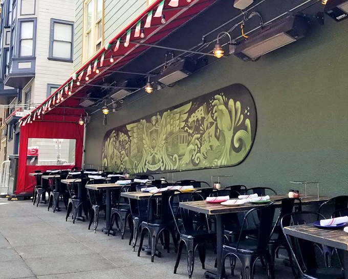 Outdoor tables where pizza dreams come true, set against a backdrop of San Francisco charm and street-side people-watching.