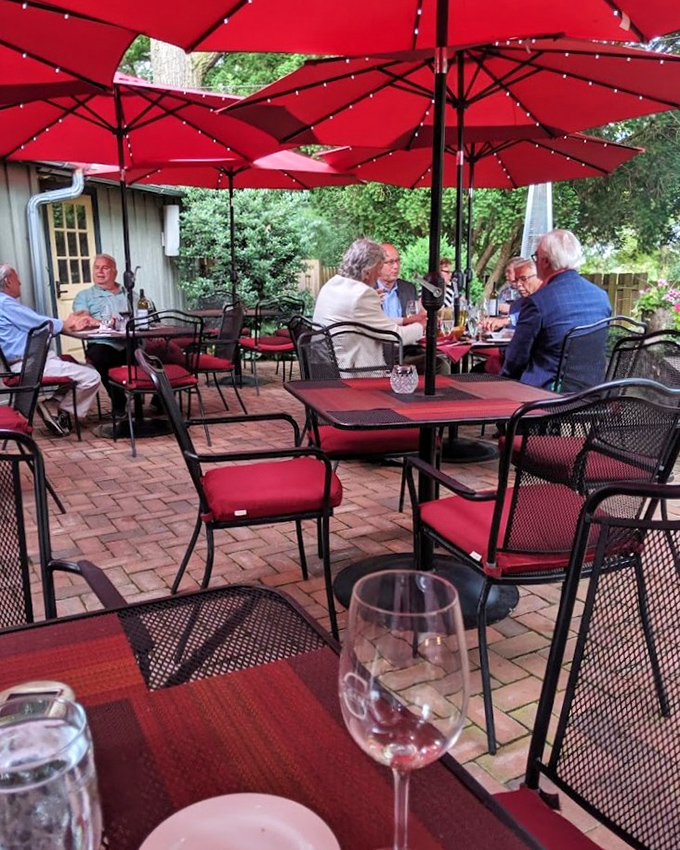 Al fresco dining under crimson umbrellas&mdash;where Lancaster County breezes carry conversations and the clinking of wine glasses across the patio.