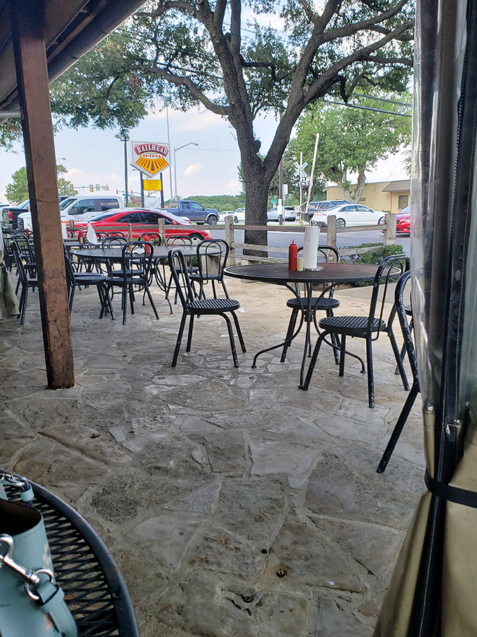 The patio where sweet tea sweats in the Texas heat and conversations flow as freely as the barbecue sauce.