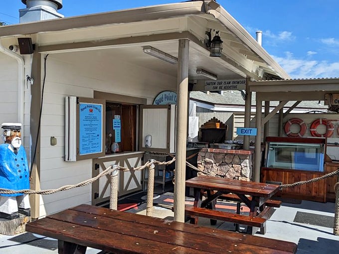 Nautical charm meets practical dining &ndash; where picnic tables, life preservers, and a sailor statue create the quintessential coastal seafood shack experience.