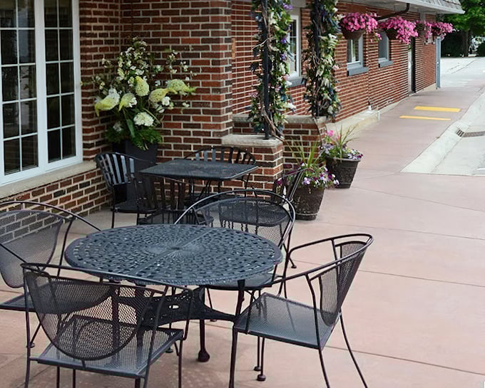 The outdoor seating area offers a charming spot to enjoy Wisconsin summer evenings, with flowers that rival the beauty of what's on your plate.