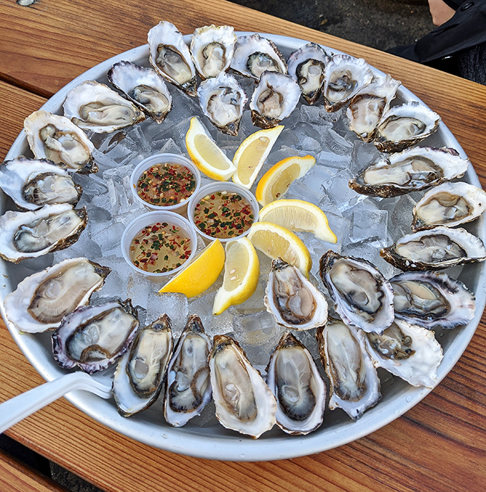 A platter of oysters arranged like a clock face of briny delights. Each one a perfect little taste of the sea's deepest secrets.